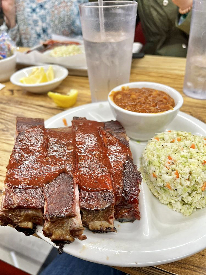 Ribs presented with no pretense, just beans and slaw standing by like loyal sidekicks. This is the superhero team-up your taste buds have been waiting for.