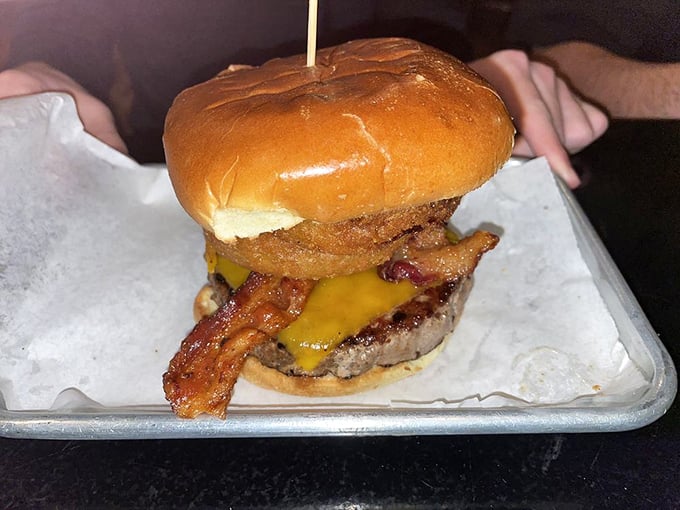 Everything's bigger in Texas, including this burger! It's stacked higher than a cowboy's tales after a long day on the range.