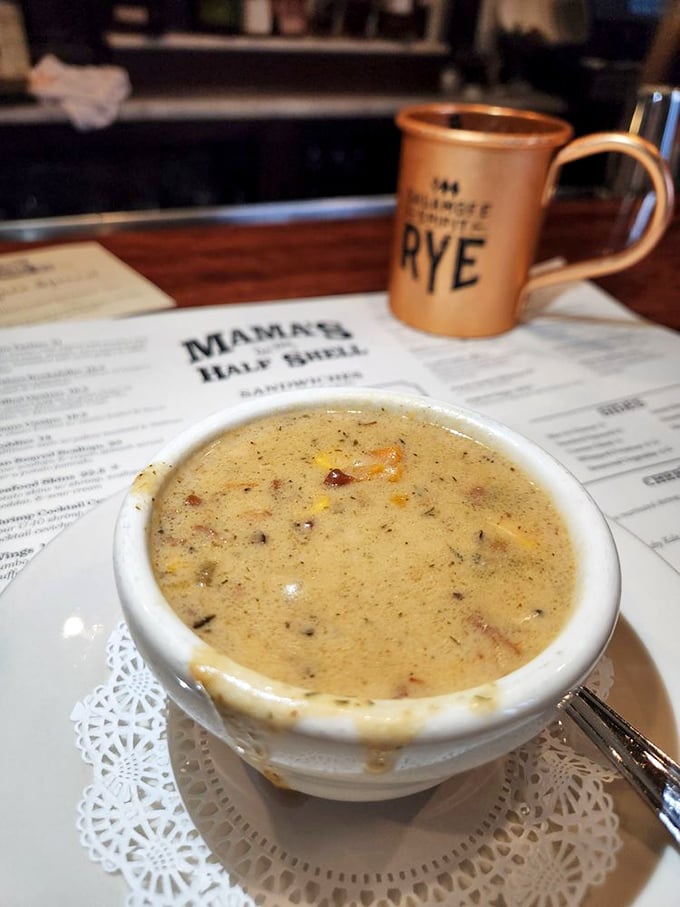 A bowl of liquid gold: Mama's clam chowder, where every spoonful is a treasure hunt for seafood lovers.