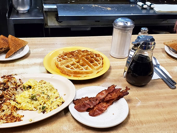 The breakfast trifecta: waffles, bacon, and eggs. It's like the holy trinity of morning meals, served up with a side of small-town hospitality.