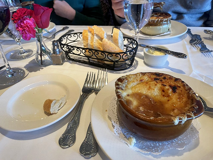 The holy trinity: bread, cheese, and soup. This French onion masterpiece is what happens when comfort food goes to finishing school in Paris.