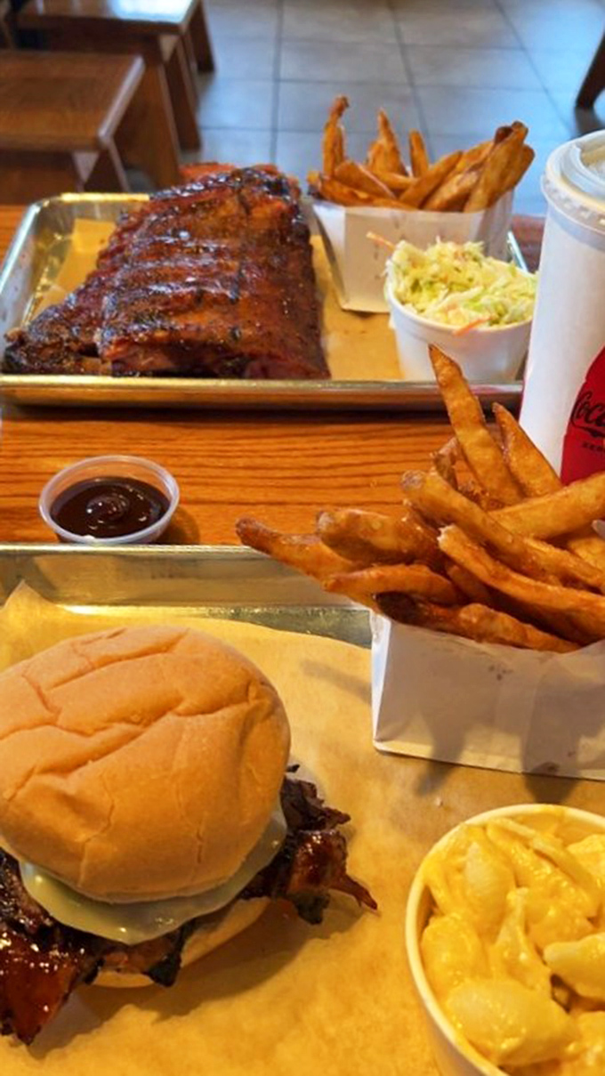 The dynamic duo of deliciousness! Ribs and a brisket sandwich join forces to create a meal that's basically a bear hug for your taste buds.