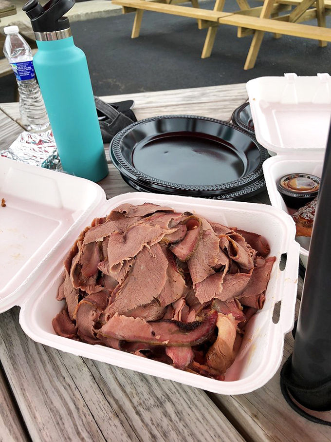 Sliced brisket that's traveled through time and smoke to reach peak deliciousness. This container holds more flavor than most five-course meals.