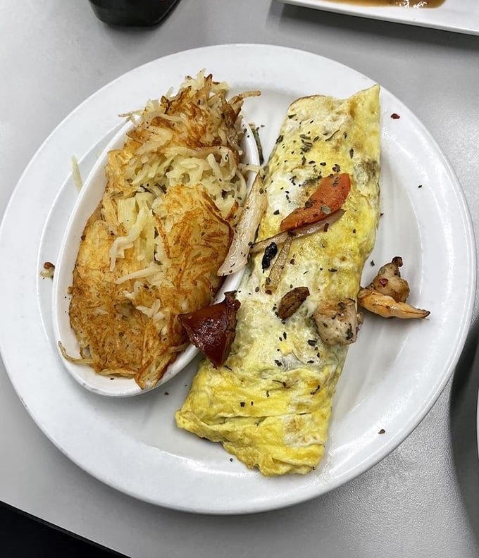The 3 meat omelet: For when you can't decide which protein to love most. It's the breakfast equivalent of a group hug.