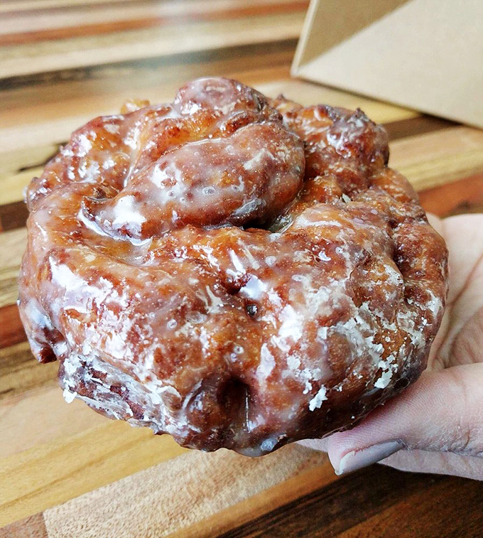 Holy fritter, Batman! This apple-packed behemoth isn't just a pastry, it's a feat of engineering. Crispy, gooey, and utterly irresistible.