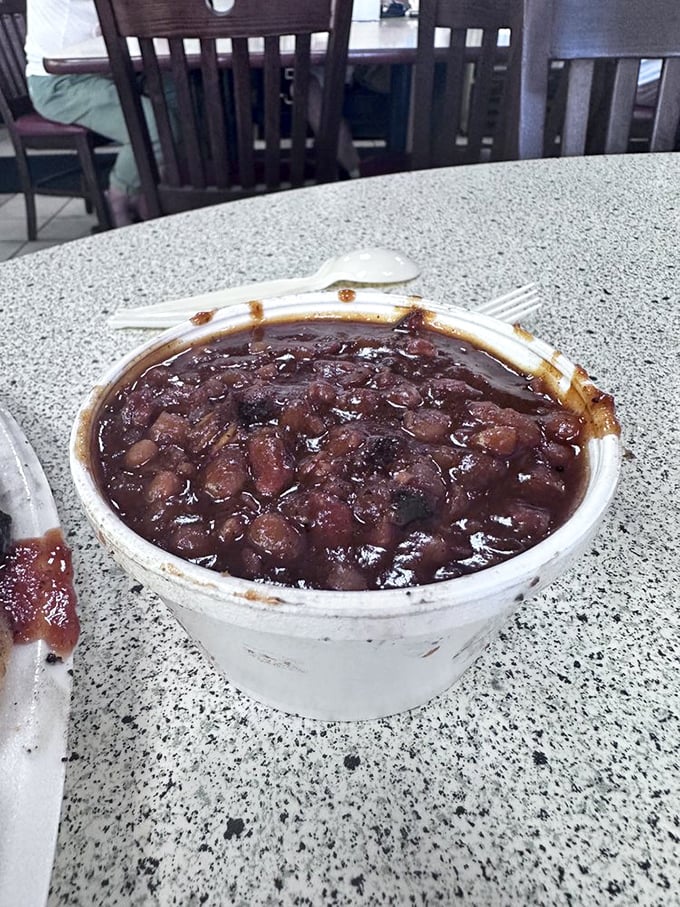 These aren't your average baked beans - they've clearly been hanging out with the right crowd in the smoker.