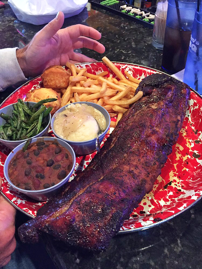 Houston, we have a platter! This cosmic collection of ribs, sides, and fixings is enough to make any astronaut consider extending their mission to Earth.
