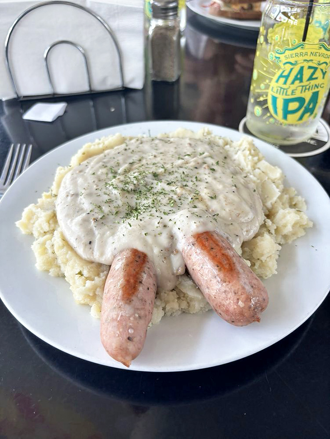 Bangers and mash: the ultimate Irish comfort food. These sausages are nestled in a cloud of creamy mashed potatoes, like a meaty lullaby for your taste buds.