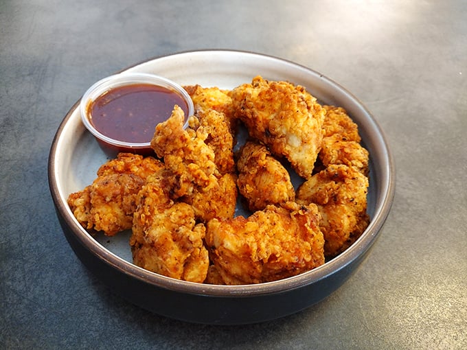 These aren't just wings; they're crispy golden nuggets of joy. Chomp's boneless wonders are like edible high-fives for your taste buds.