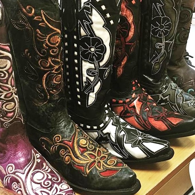 These aren't just boots; they're wearable art with Kansas swagger. Cowgirl couture at thrift store prices.