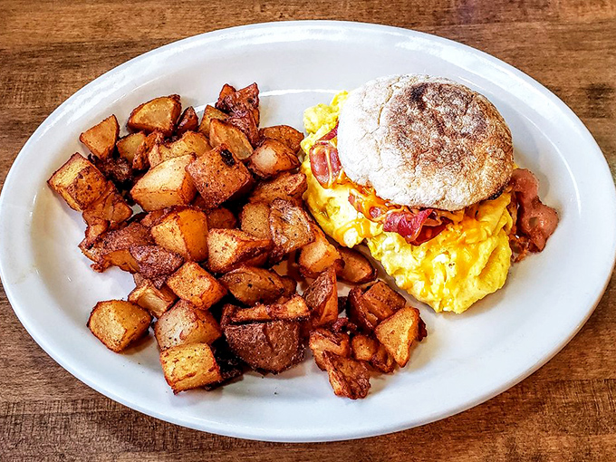 Breakfast sandwich or edible work of art? This plate is giving serious "still life with eggs and cheese" vibes, but way more delicious.