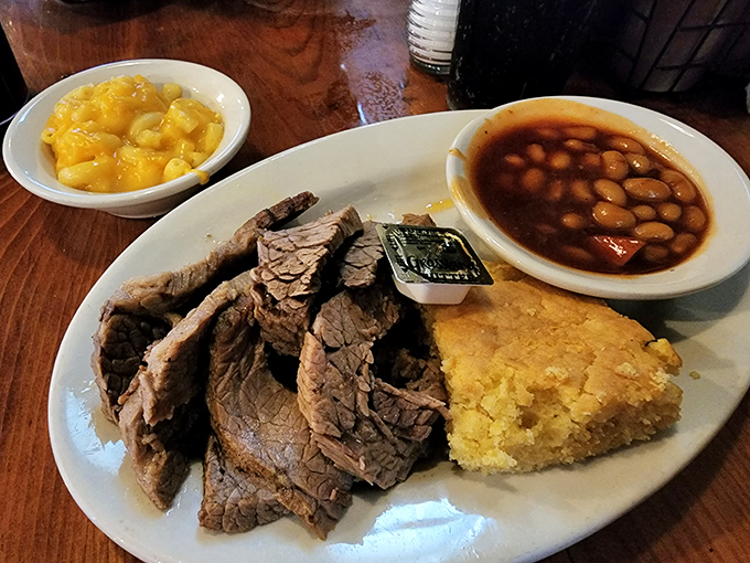 Brisket so tender, it practically melts on the plate! Paired with classic sides, it's a comforting hug for your taste buds.