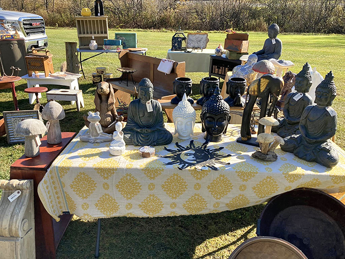 Buddha brings serenity to the flea market chaos. These statues have seen less tranquility in their previous homes than they're witnessing now.