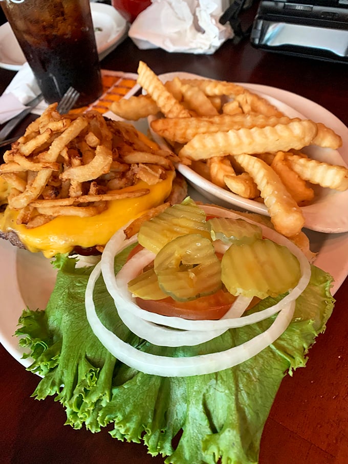 This burger's got more layers than a Shakespeare play, and it's just as likely to leave you speechless. A true American classic.