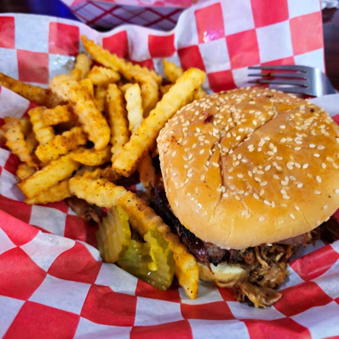 This isn't just a burger; it's a hand-held flavor explosion. With those crispy fries, it's like a hug for your taste buds.