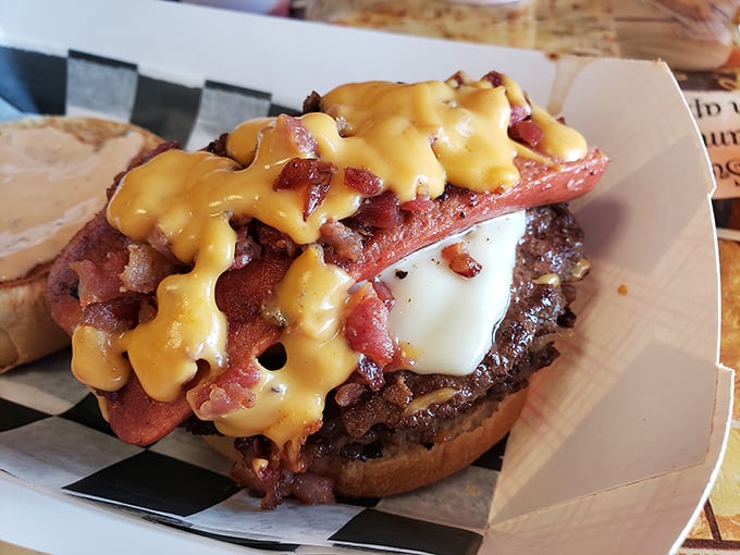 Warning: This burger may cause spontaneous happiness! Loaded with toppings, it's a towering testament to the joys of excess.