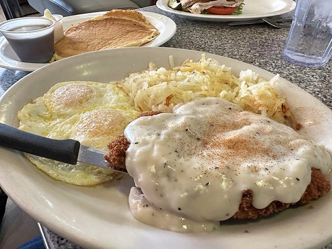 Chicken fried steak: Where Southern comfort meets Idaho hospitality. Smothered in gravy, it's like a warm hug for your taste buds.