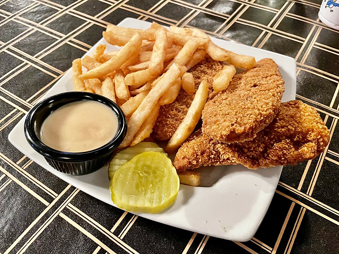 Comfort food alert! Golden-brown tenders and crispy fries &ndash; the dynamic duo that never fails to satisfy. Sometimes, simple really is best.