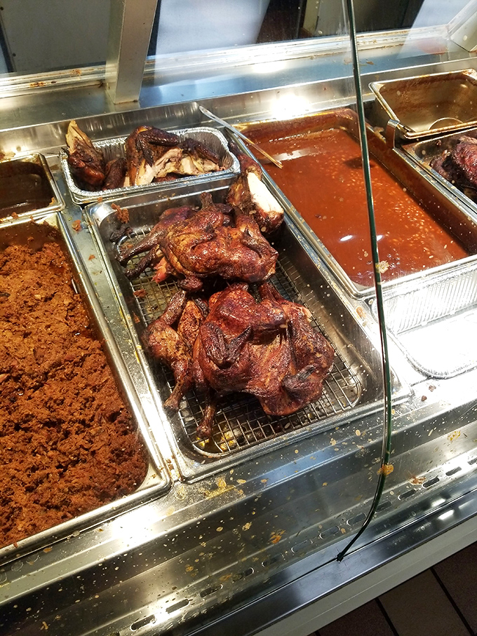 This isn't just barbecued chicken; it's a masterclass in patience, with smoke and time transforming the humble bird into something worth crossing roads for.