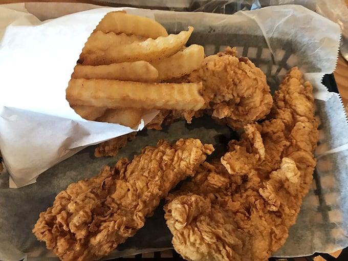 Chicken strips that actually deserve the name "strips" rather than "tiny fragments," served alongside fries that clearly never saw the inside of a freezer.