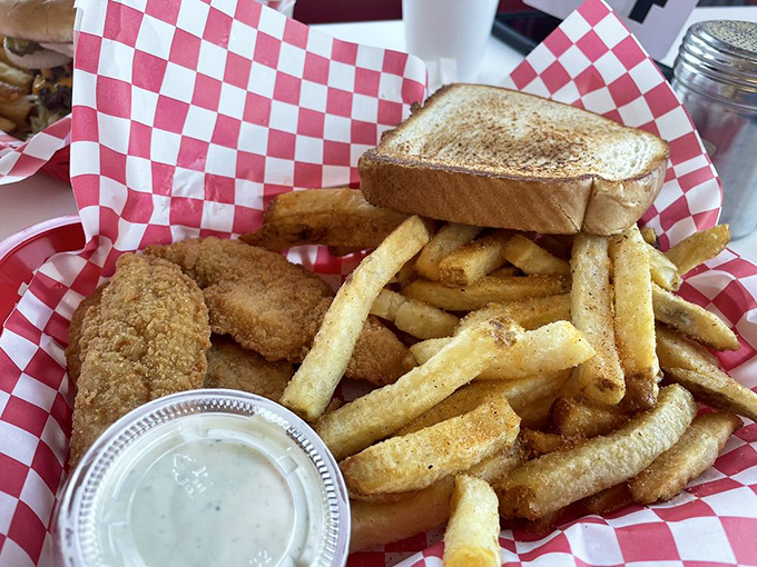 Chicken tenders that could make Colonel Sanders jealous! Paired with those golden fries, it's a basket of pure, crispy joy.