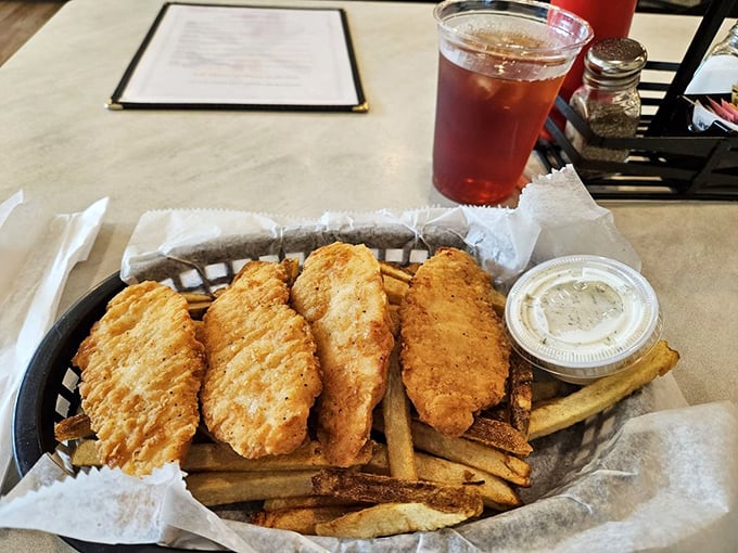 Chicken tenders that actually taste like chicken, served with fries that didn't spend their entire existence in a freezer waiting to meet you.