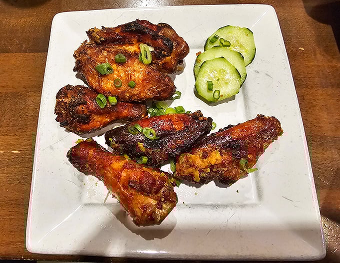 Chicken wings that make you question your lifelong loyalty to buffalo sauce. Those glistening beauties deserve their own fan club.