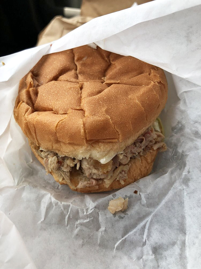 The sandwich that launched a thousand road trips. Chopped pork and slaw on a soft bun &ndash; simple perfection you can hold in your hand.