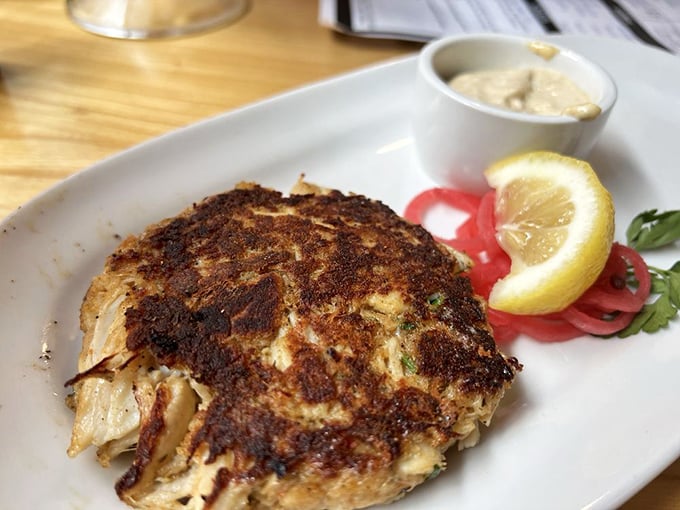 These crab cakes are so golden and crispy, they'd make King Midas jealous. Paired with that tangy sauce? It's a royal feast!