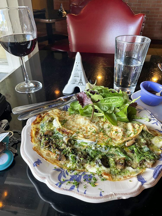 This isn't just a cr&ecirc;pe; it's a love letter to escargot, written in cheese and wrapped in delicate pancake.