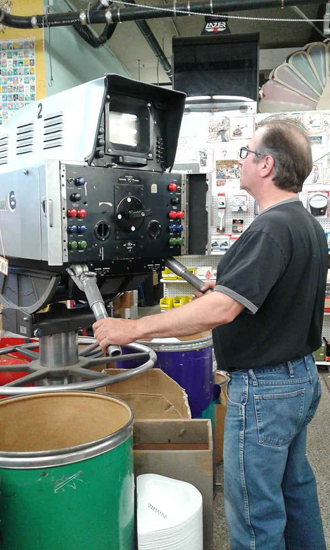 Eureka! This gentleman seems to have found his holy grail among the treasures. At Ax-Man, every aisle is a potential Indiana Jones adventure.