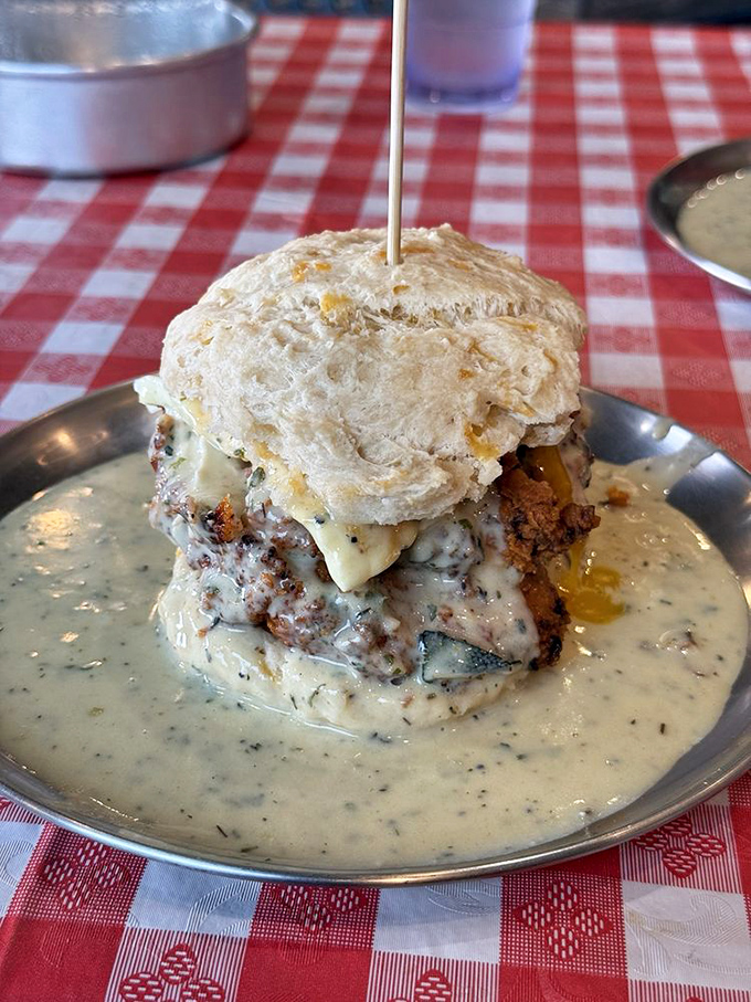 The Early Bird Biscuit Sandwich: Where fried chicken meets gravity-defying gravy. It's a towering testament to breakfast engineering.