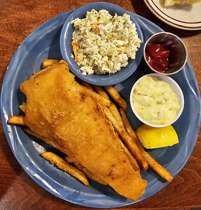 Fish so crispy, it could audition for a potato chip commercial. Paired with creamy coleslaw, it's a seaside vacation on a plate.