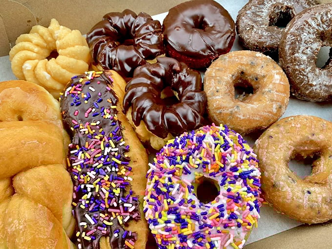 Fresh from the fryer! These glistening rings aren't just donuts; they're warm hugs for your taste buds.