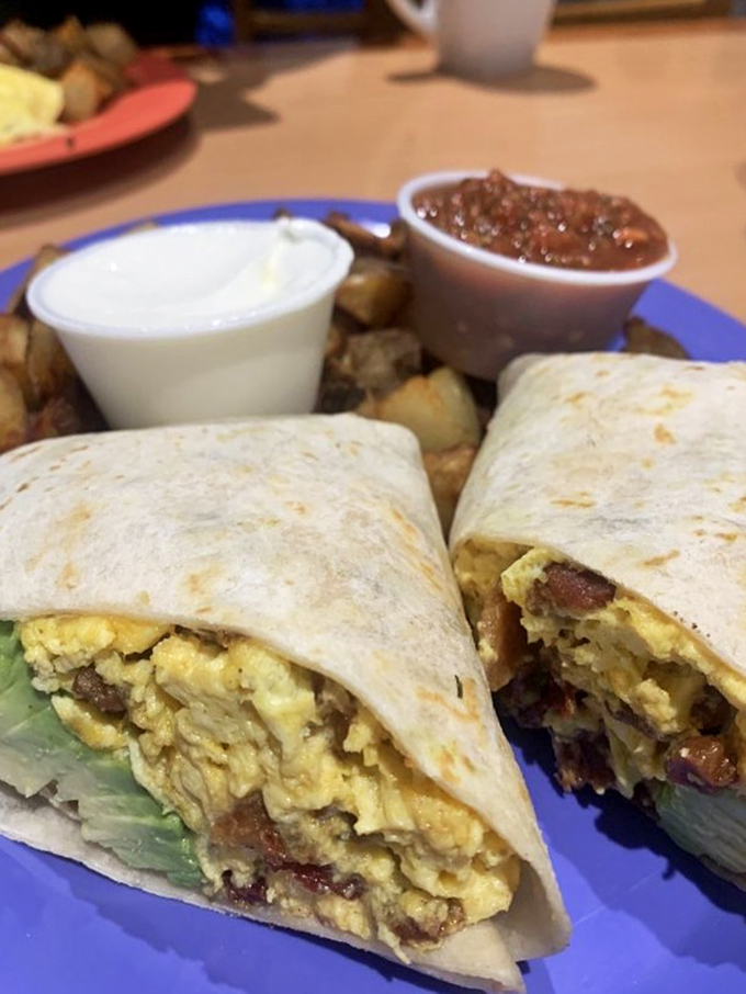 Burrito alert! This handheld happiness is packed tighter than a rodeo cowboy's jeans. It's a breakfast, lunch, and food coma all rolled into one.