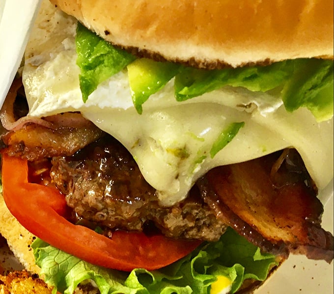 Now that's what I call a balanced meal! Protein, carbs, and veggies all in one handheld package. Who needs a plate when you've got two hands?