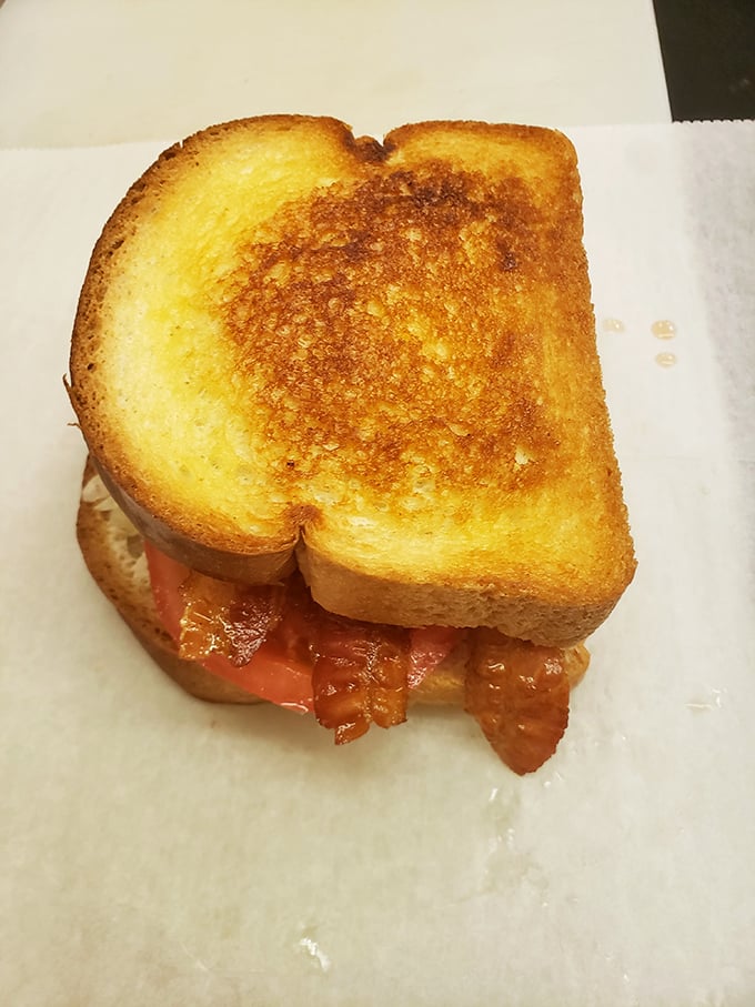 Grilled cheese gets a promotion with bacon that's been cooked to that perfect spot between chewy and crisp. Comfort food with a promotion.