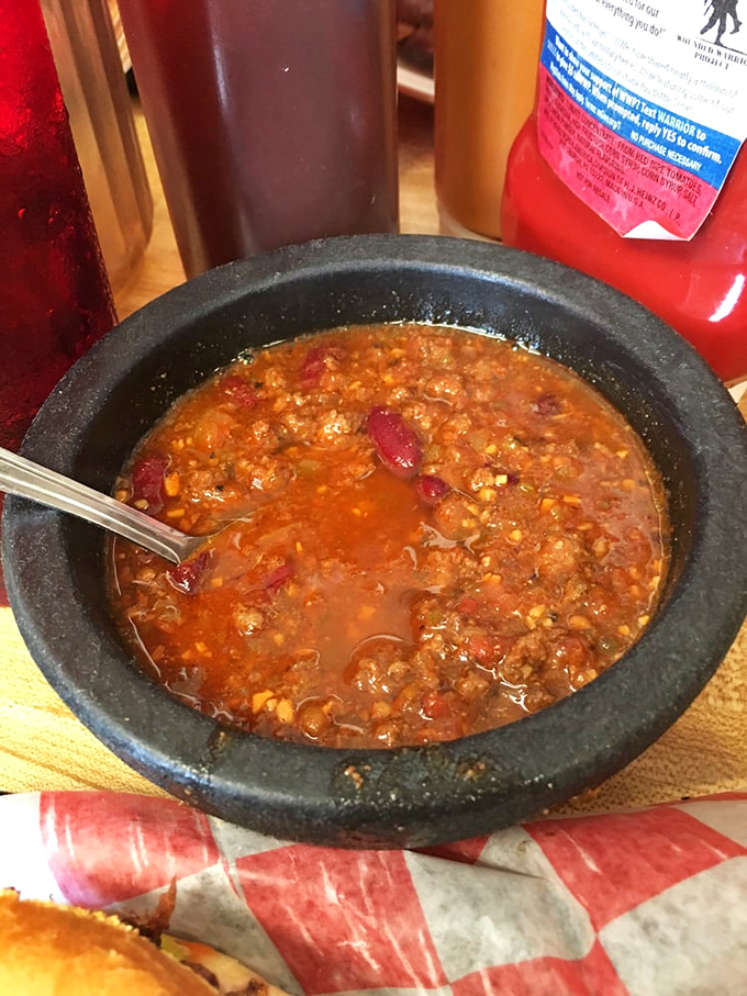 Warning: This chili may cause spontaneous happiness. It's like a warm hug for your taste buds, with a kick that'll wake up your senses.