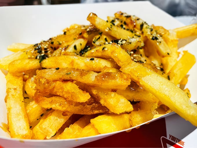 French fries got dressed up for the party. These honey garlic fries with their seaweed flecks are what regular fries dream of becoming when they grow up.