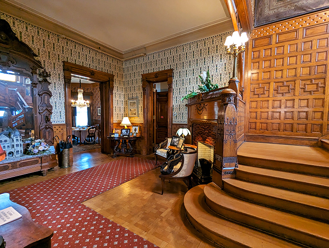 Wood paneling, patterned wallpaper, and a staircase fit for royalty. It's like stepping into a time machine set to "fabulous."