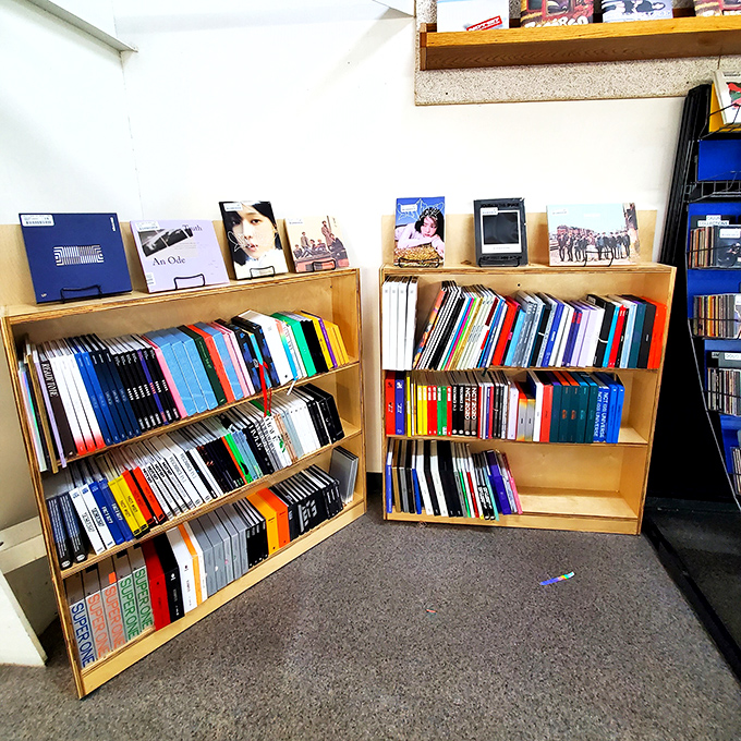 Bookshelf rainbow alert! These colorful spines are a feast for the eyes. It's almost too pretty to disturb... almost.