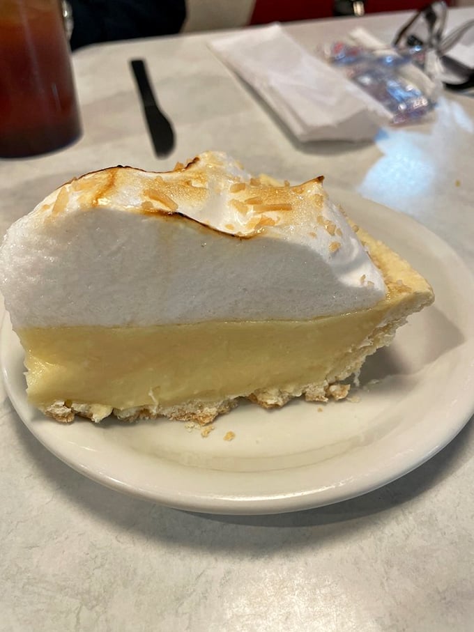 Lemon meringue pie so high, it's got altitude sickness! This slice of heaven is fluffier than a cloud and zestier than a sitcom one-liner.