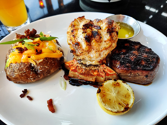 Who says you can't have it all? This plate is the "yes, and" of dinners—yes to the succulent lobster, and absolutely yes to that loaded baked potato.