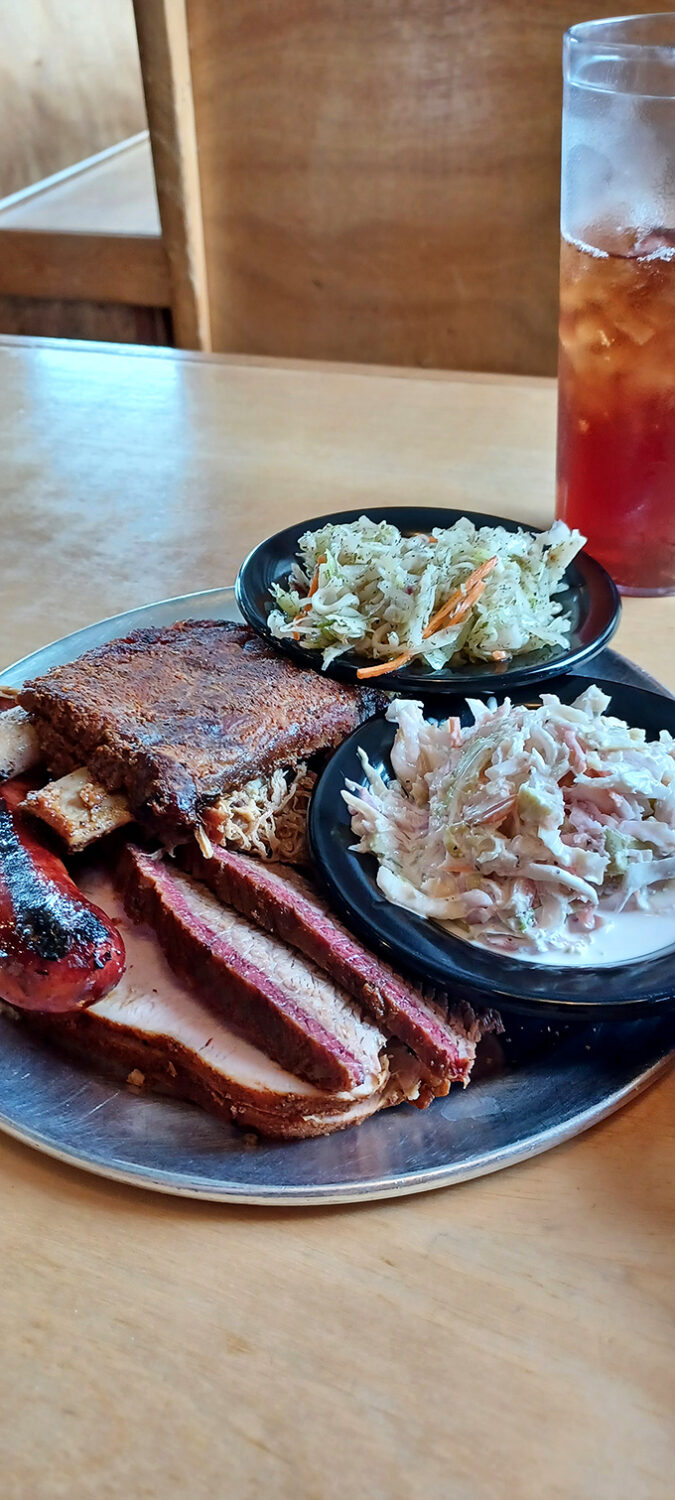 A barbecue trinity that would make meat lovers weep with joy. The smoke ring on that brisket is practically wearing a halo.