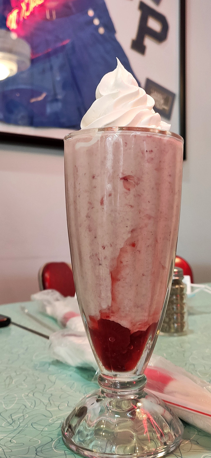 Pretty in pink! This strawberry shake is dressed to impress, topped with a swirl that's more photogenic than most Instagram influencers.