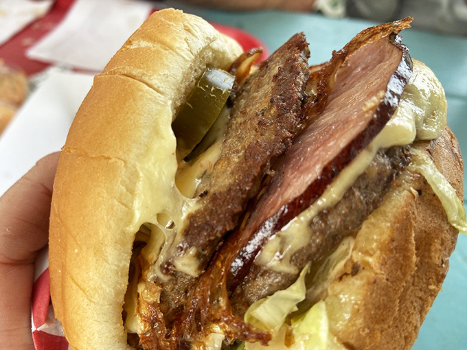 The Monster Burger: where ham and beef unite in a glorious alliance of meaty magnificence.