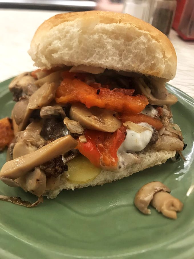 Mushroom madness meets peppery perfection! This burger is so loaded, it could moonlight as a Thanksgiving cornucopia.