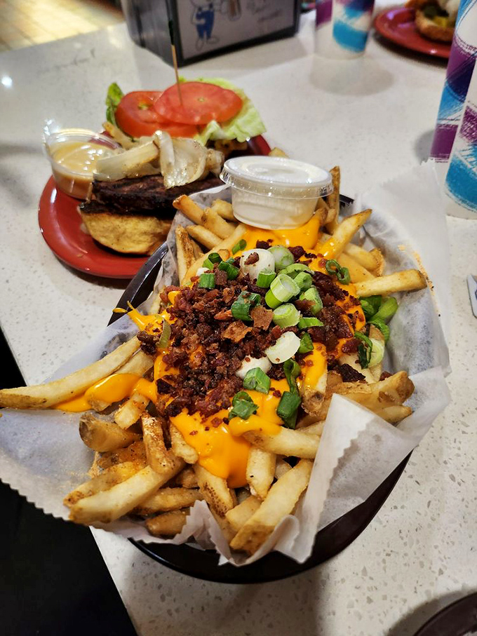 Fries gone wild! These loaded spuds are dressed to impress, sporting more toppings than a sundae bar at a kids' birthday party.
