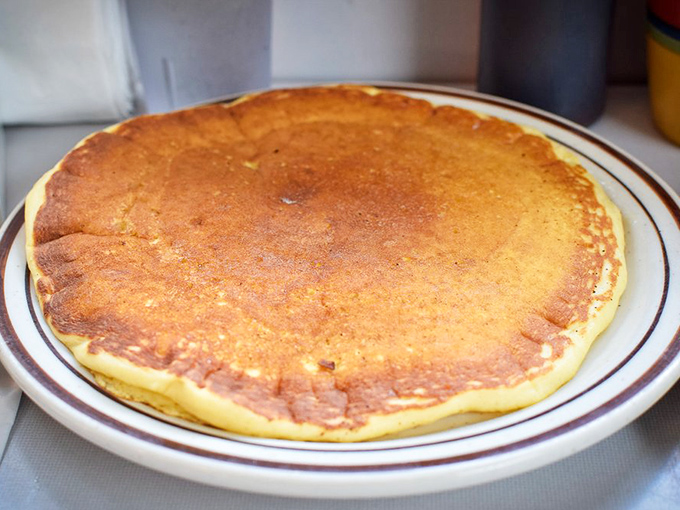 Pancakes so golden, they'd make King Midas jealous! Fluffy discs of joy that'll have you singing, "Oh, what a beautiful morning!"