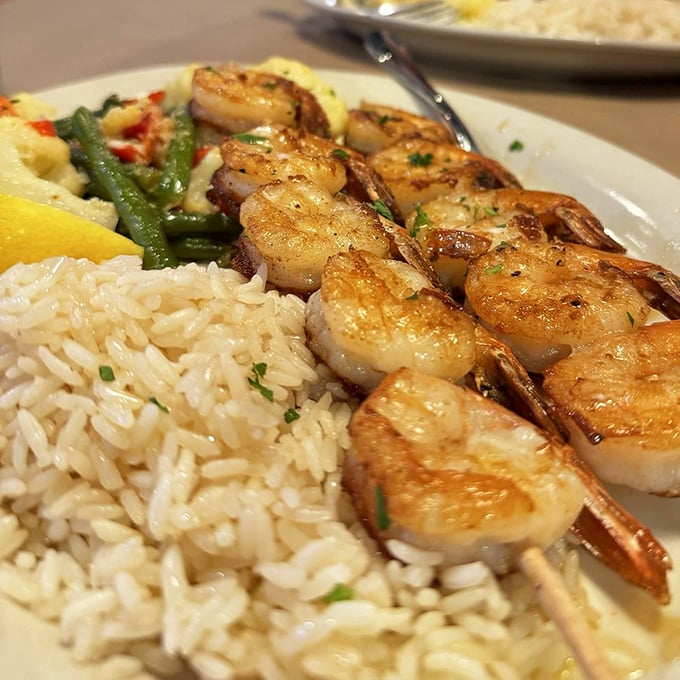 Shrimp on a stick? It's like a seafood lollipop for grown-ups! These Parmesan-crusted skewers are turning dinner into a seaside carnival of flavors.